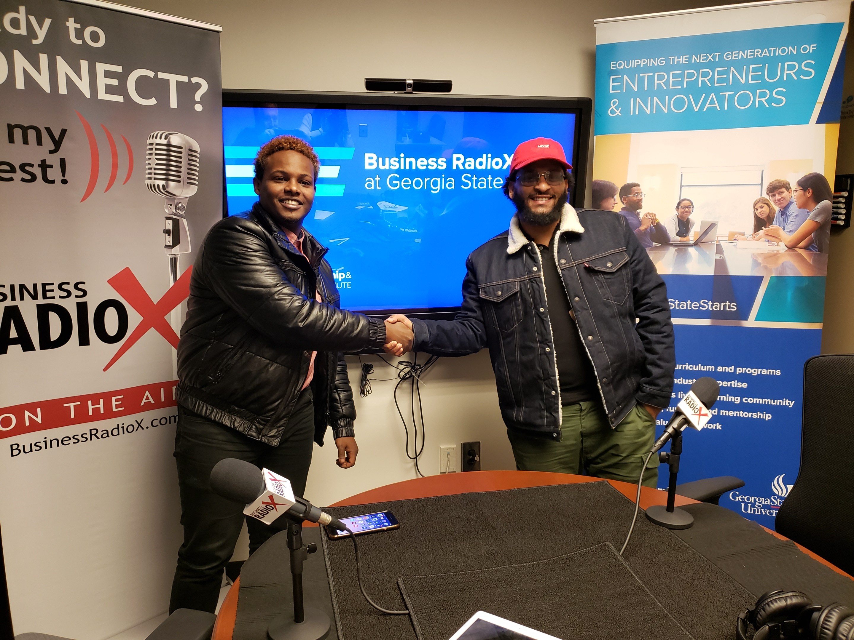 Ishak Yusuf and Hashim Addow with Famous Joint: Content Cafe - Business ...